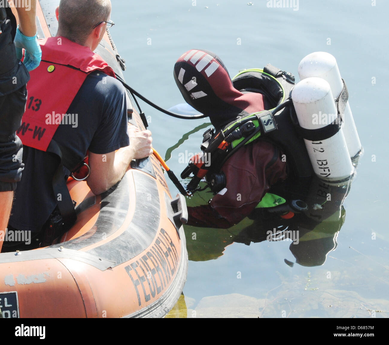 Divers search for a 14-year-old boy, who allegedly died in a ship ...