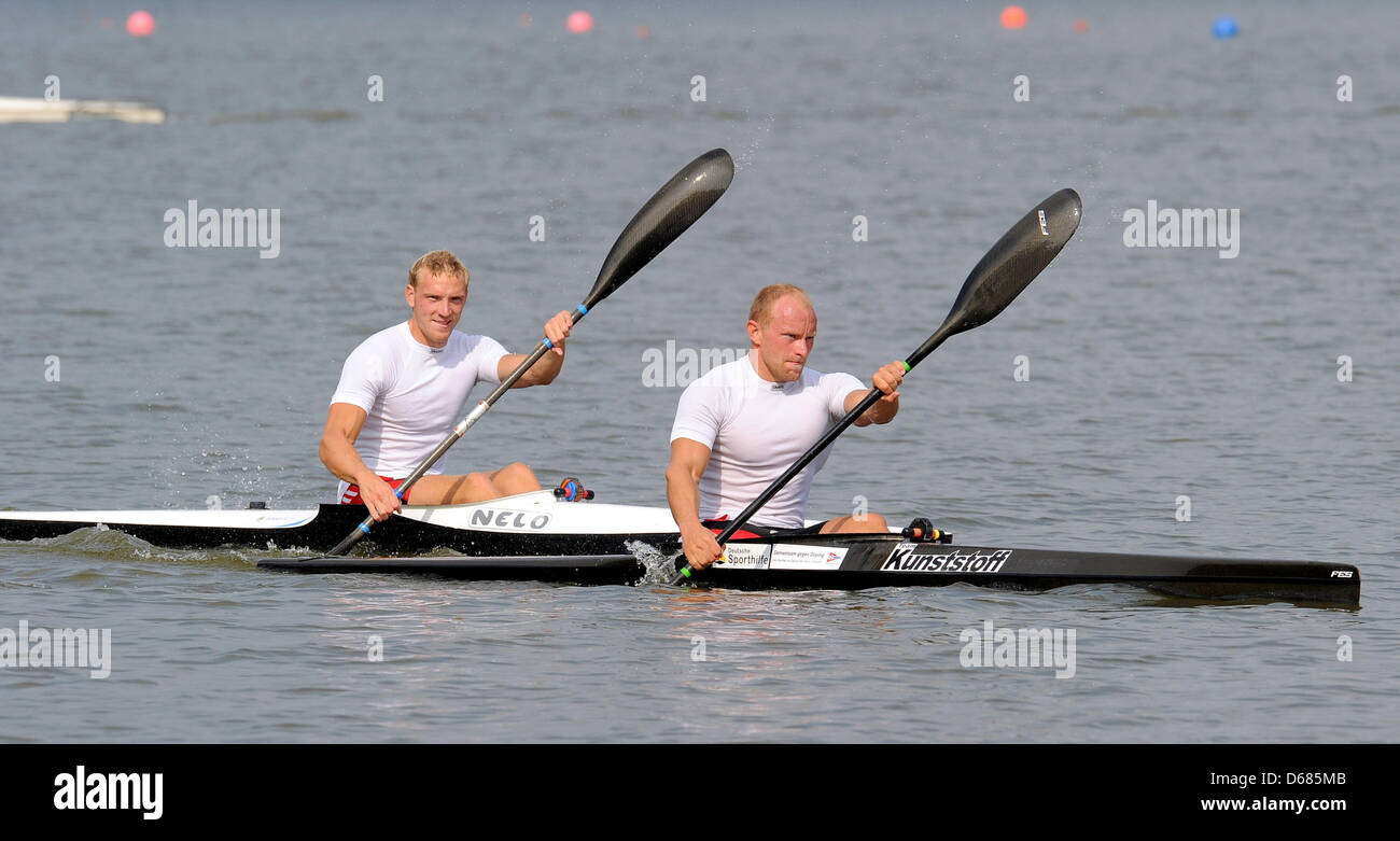 German canoeists Martin Hollstein (L) and Norman Broeckl in action ...