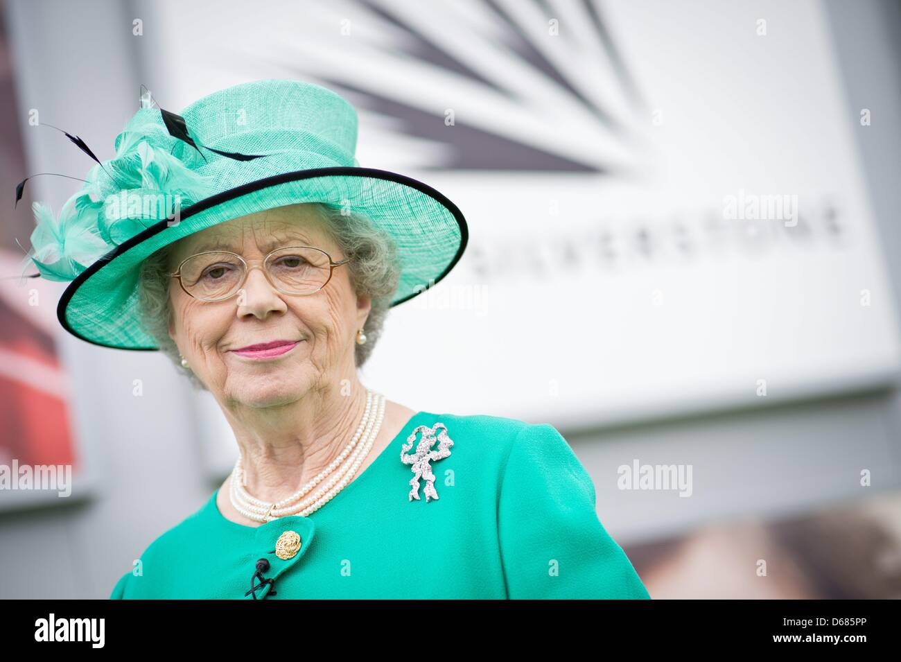 A lookalike of Queen Elizabeth pictured at the Silverstone race track ...