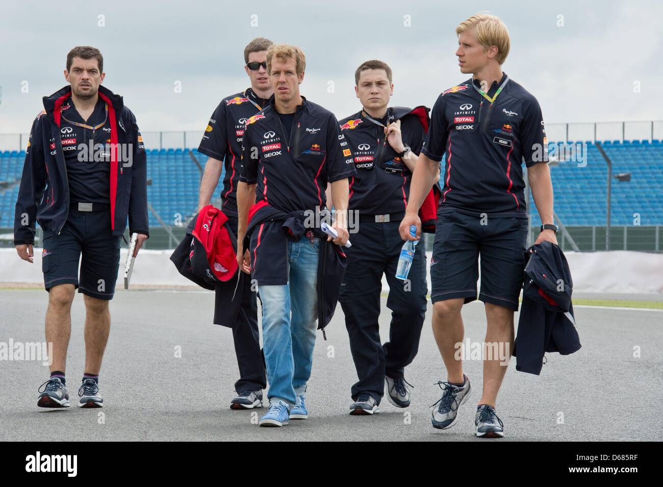 German Formula One driver Sebastian Vettel (M) of Red Bull, his race ...