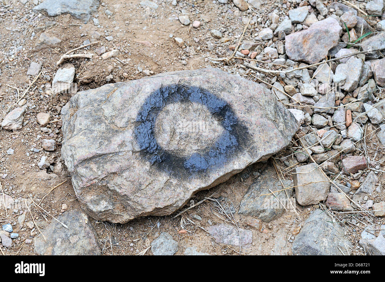 round stone marked with a black Stock Photo - Alamy