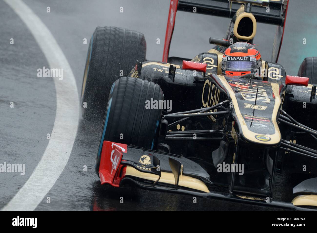 French Formula One driver Romain Grosjean of Lotus steers his car ...