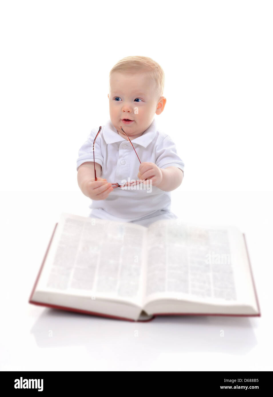 Little boy reads a big book Stock Photo - Alamy