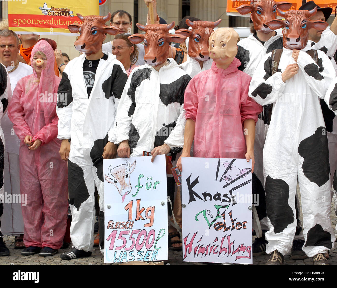 Vegetarian demonstrators dressed as cows and pigs protest against the ...