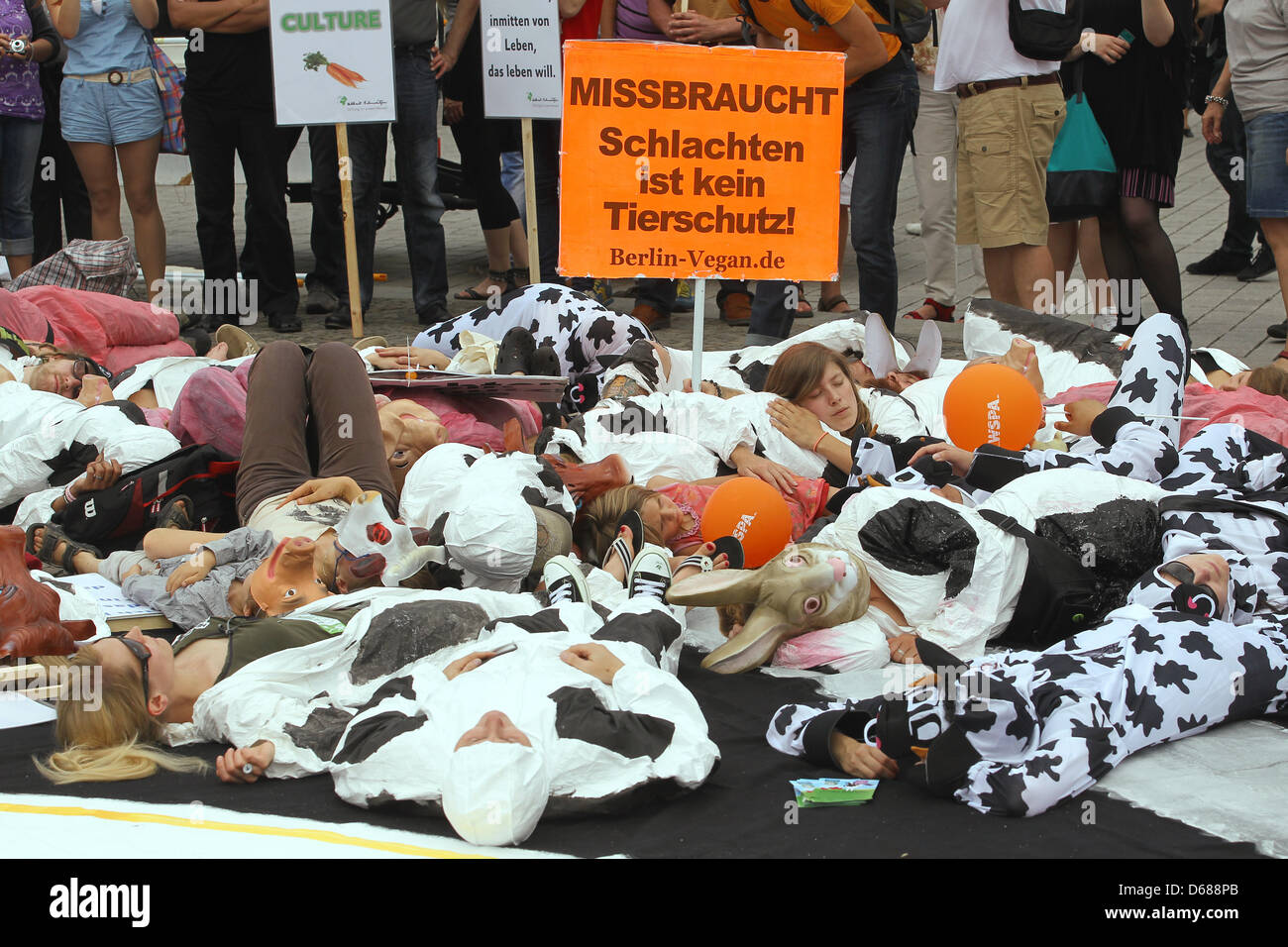 Vegetarian demonstrators dressed as cows and pigs protest against the ...