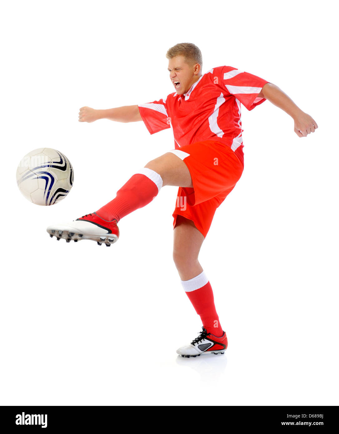 Boy playing football pass Cut Out Stock Images & Pictures - Alamy