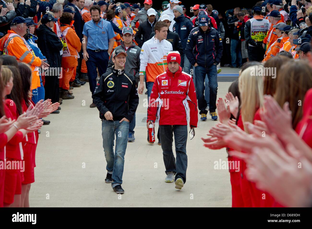 French Formula One driver Romain Grosjean of Lotus (L) and Spanish ...