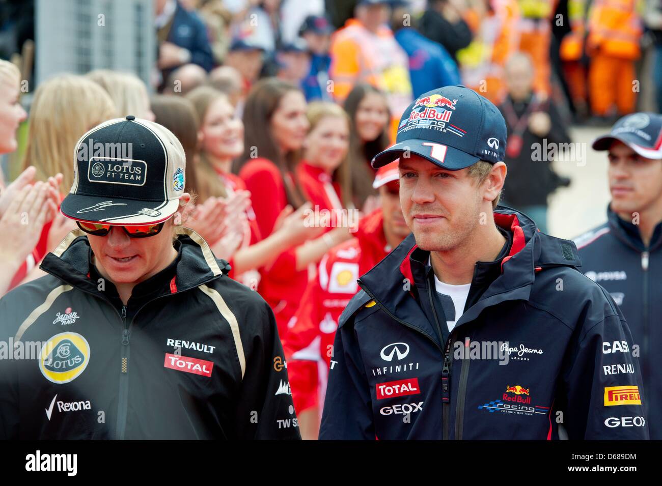 Finnish Formula One driver Kimi Raikkonen of Lotus (L) and German ...