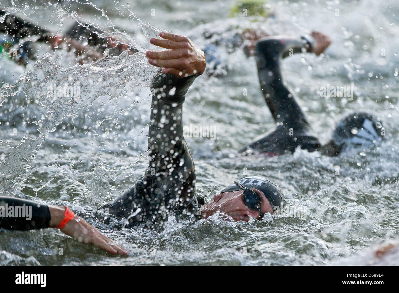 Triathletes start swimming during the Triathlon Challenge Roth in ...