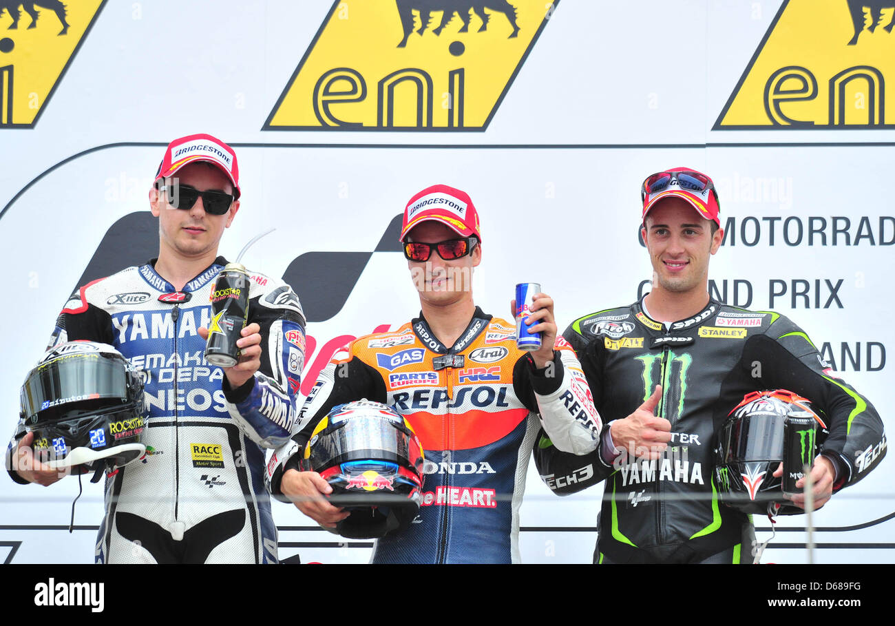 Spanish rider Daniel Pedrosa of Team Repsol Honda (C) wins the German ...