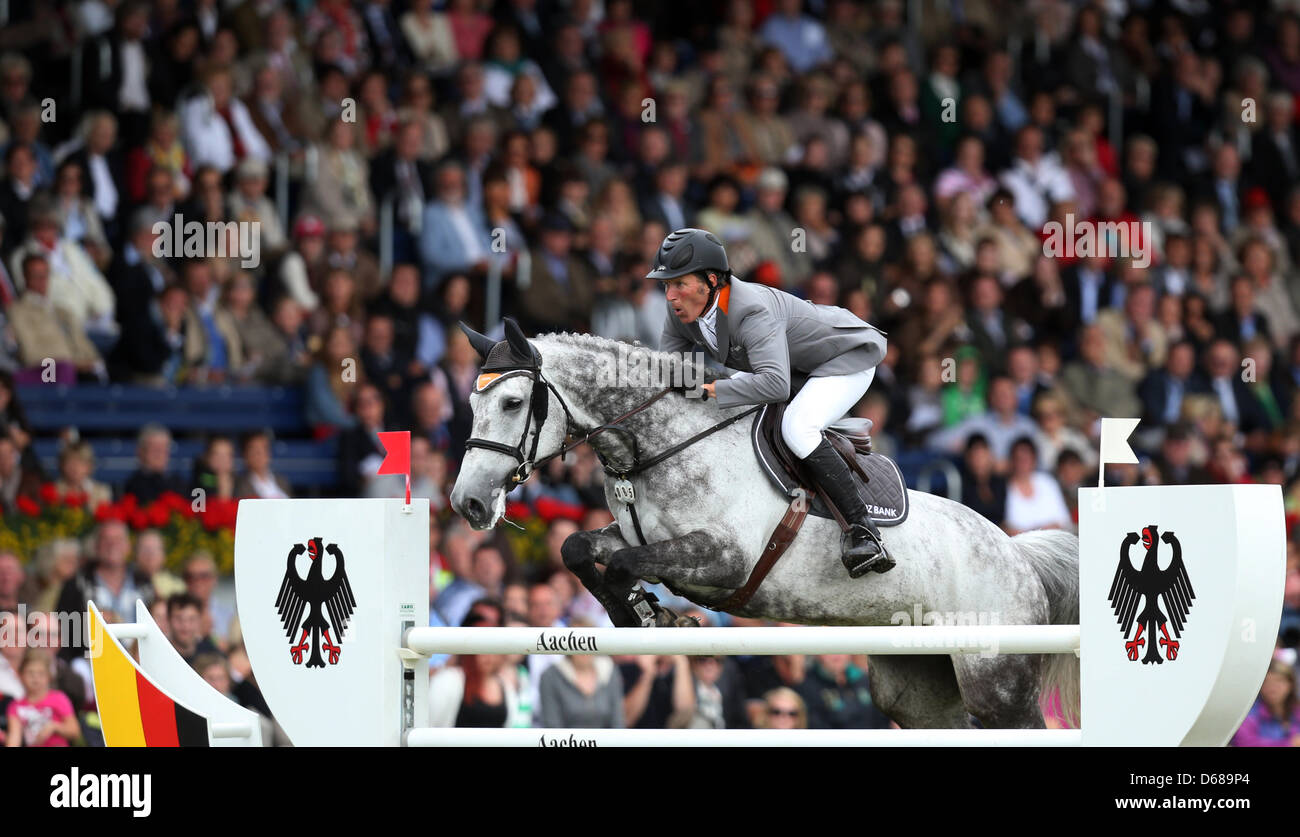 German show jumper Ludger Beerbaum jumps with his horse Chiara during ...