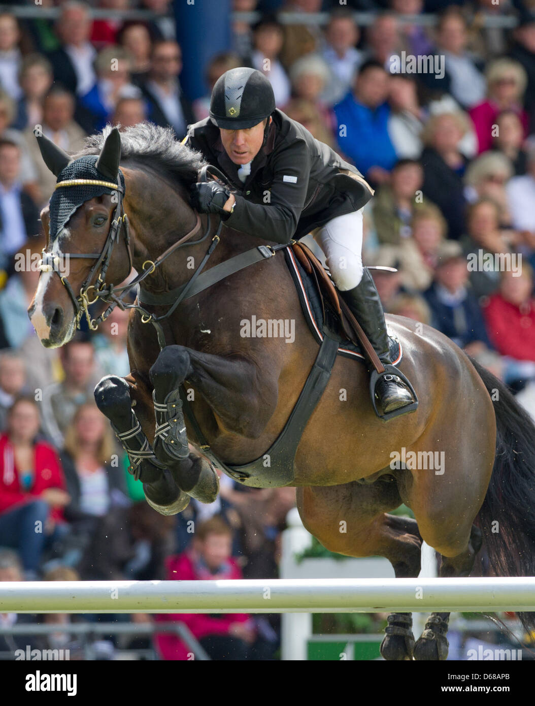 British show jumper Michael Whitaker jumps with his horse Gig Amai ...