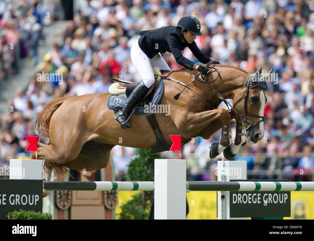 Swiss show jumper Janika Sprunger on Palloubet d'Halong jumps during ...