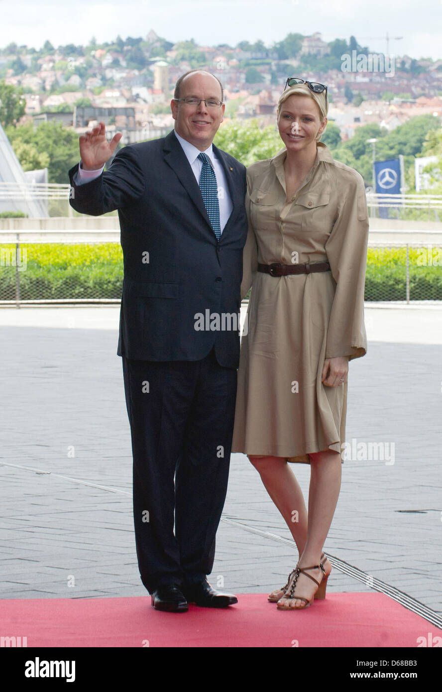 Prince Albert II of Monaco and his wife Charlene stand in front of the ...