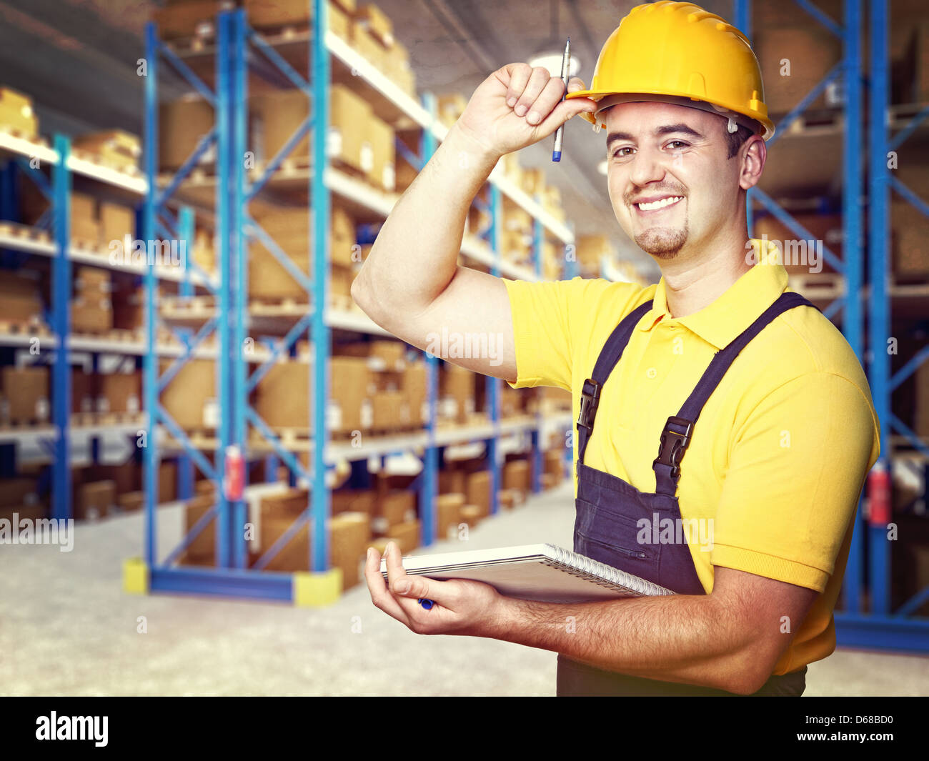portrait of smiling worker in warehouse Stock Photo - Alamy