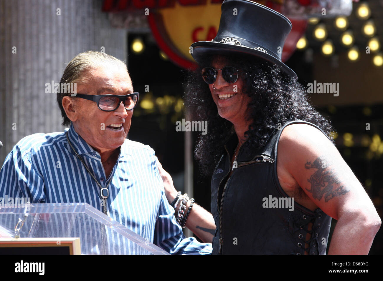 US film producer Robert Evans (L) poses with US musician Slash during ...