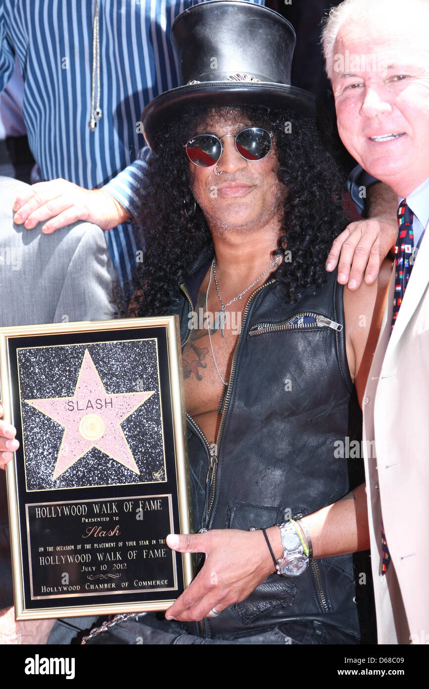 US musician Slash poses with his star on the Hollywood Walk of Fame ...