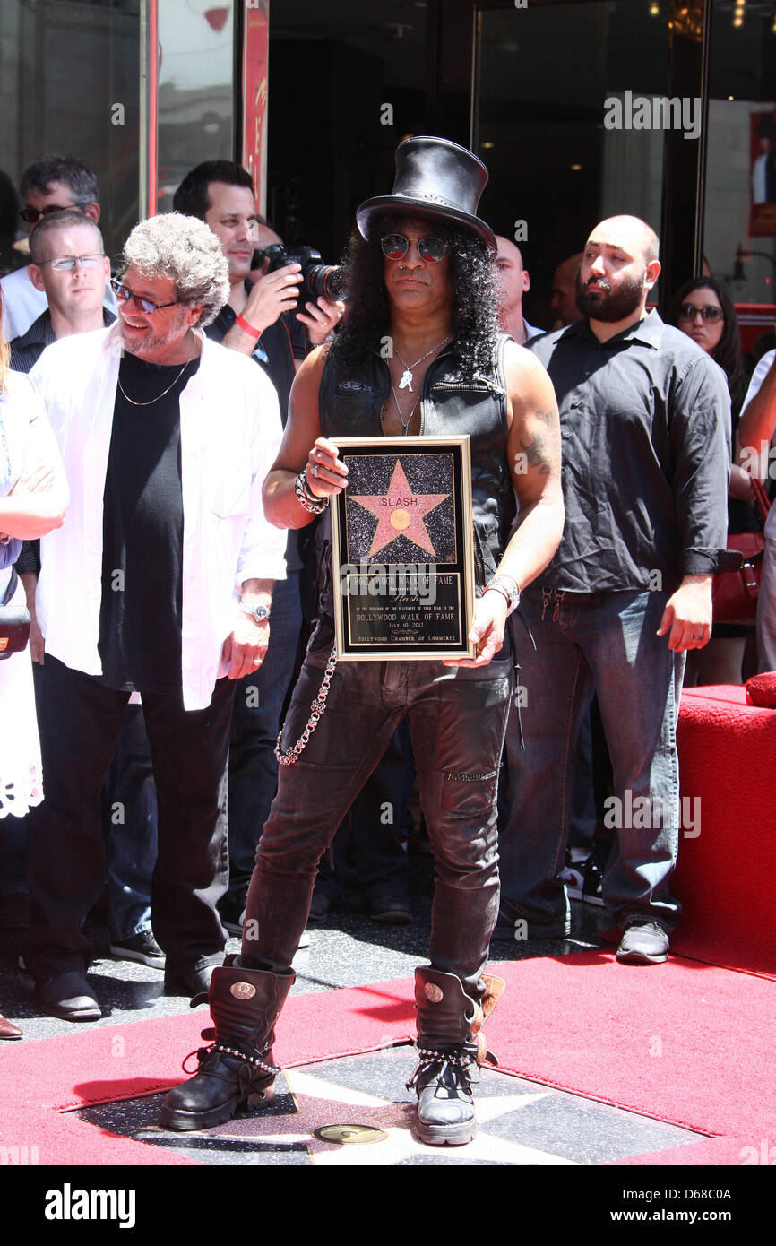 US musician Slash poses with his star on the Hollywood Walk of Fame ...