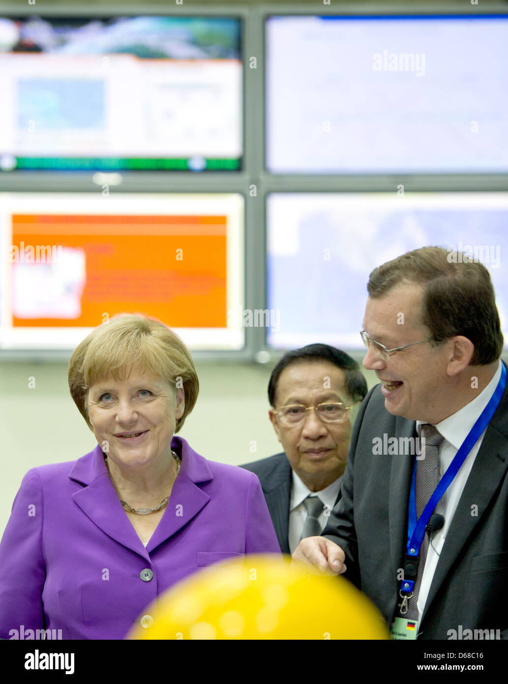 German Chancellor Angela Merkel (CDU) and project manager Joerg ...