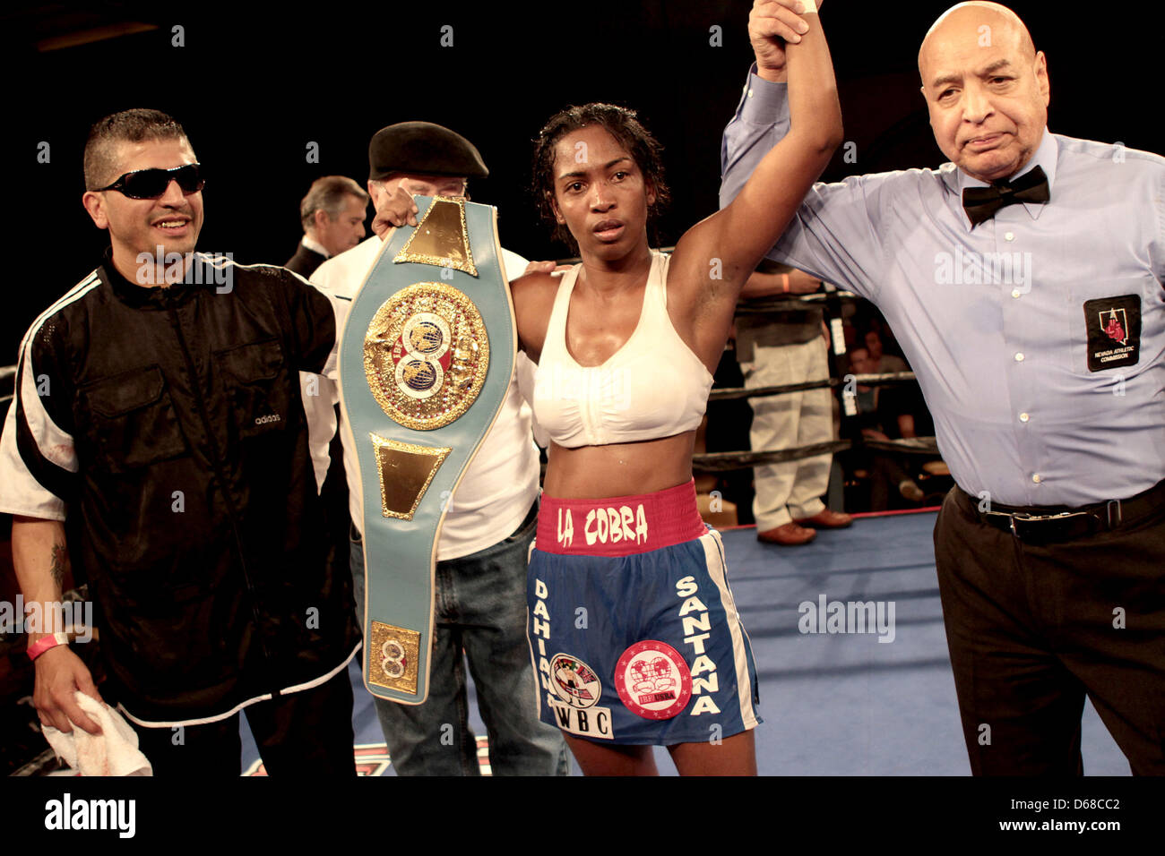 Dahiana Santana, holding up her belt after winning the IBF Female ...
