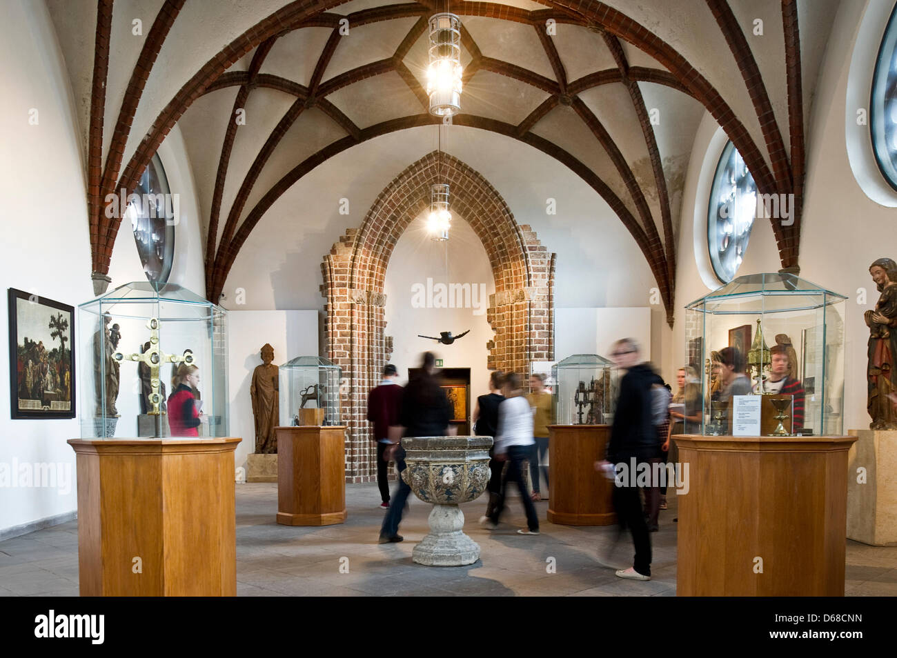 Visitors walk the exhibition in the gothic chapel of the Markisches ...
