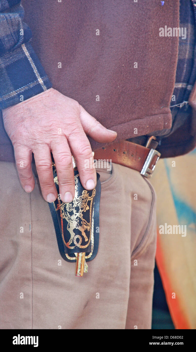 gun-toting cowboy's hand before the challenge at the last blood Stock ...