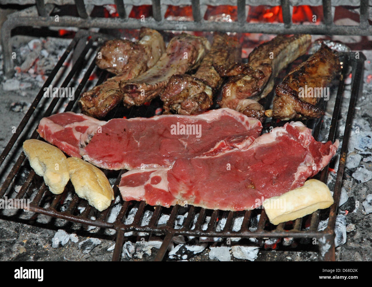 beef steaks and chops cooked barbecued pork on the barbecue grill Stock ...