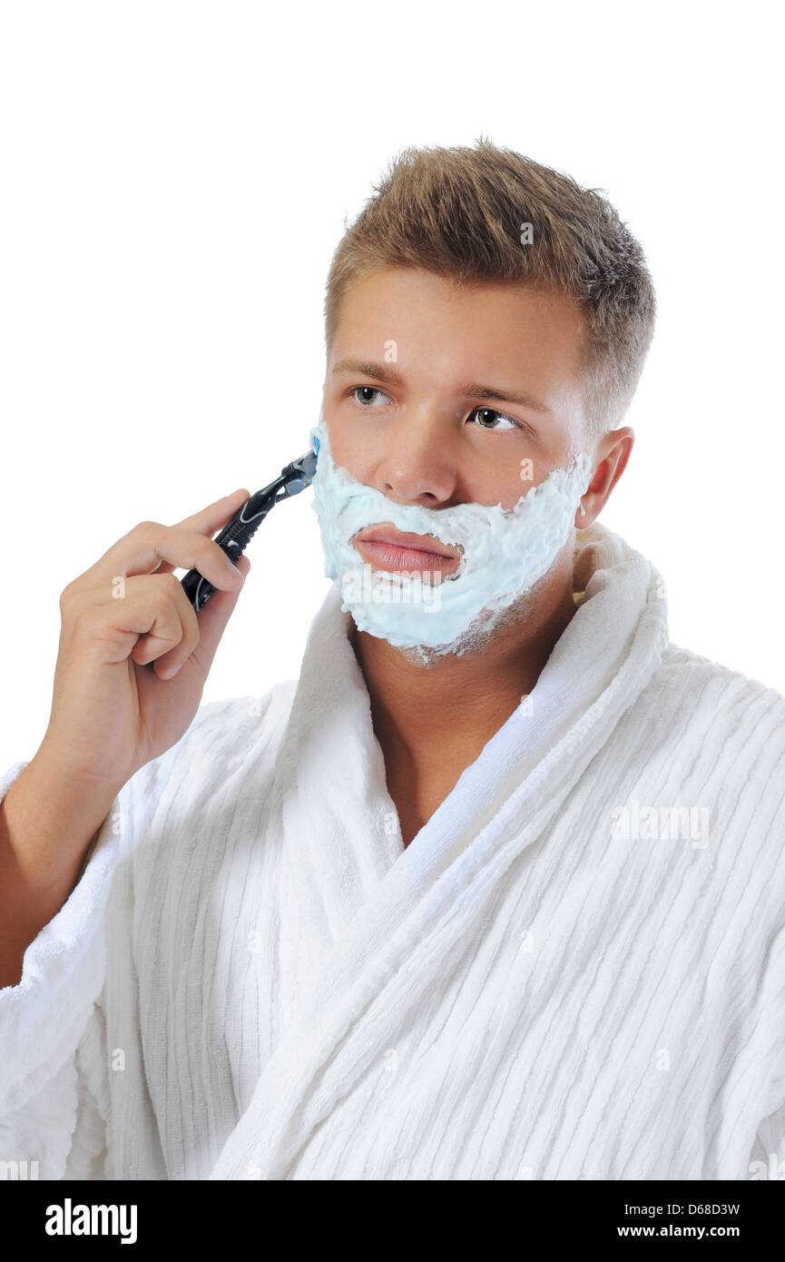 Young man shaving Stock Photo - Alamy