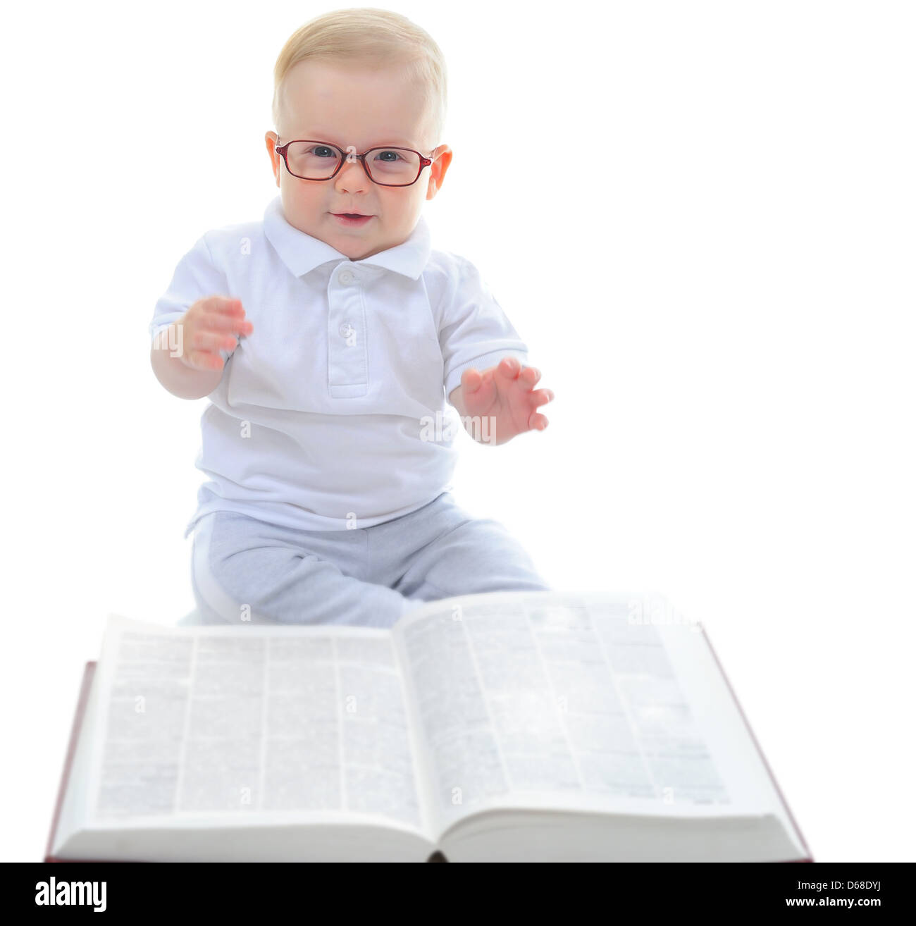 Little boy reads a big book Stock Photo - Alamy