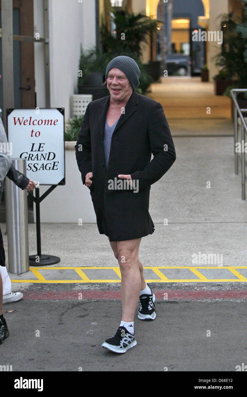A pantsless Mickey Rourke departs Cafe Roma and puts on a pair of jeans ...