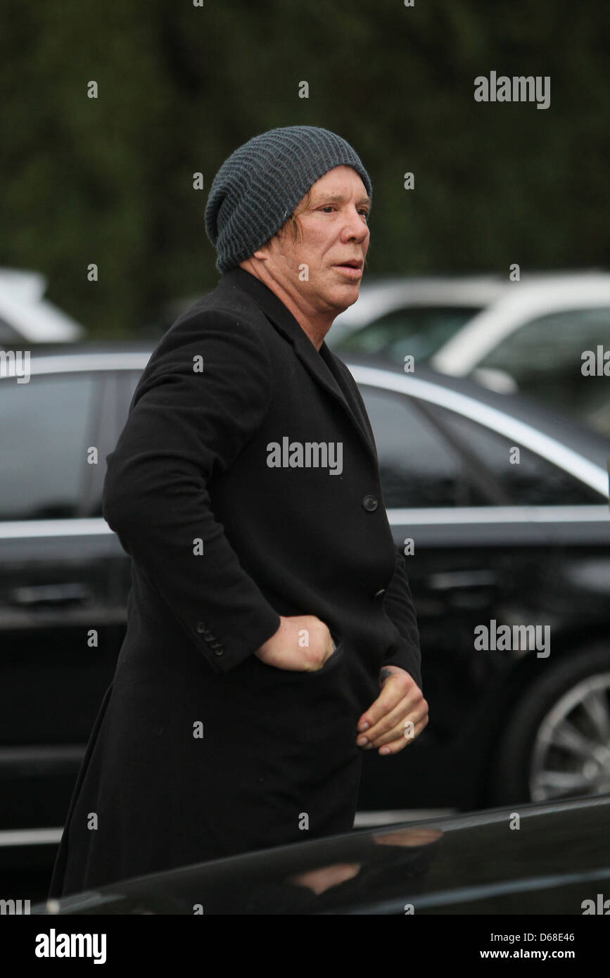 A pantsless Mickey Rourke departs Cafe Roma and puts on a pair of jeans ...