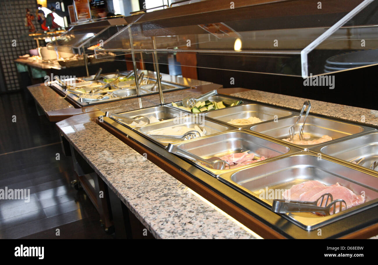 steel tray filled with food inside the self service Chinese restaurant ...