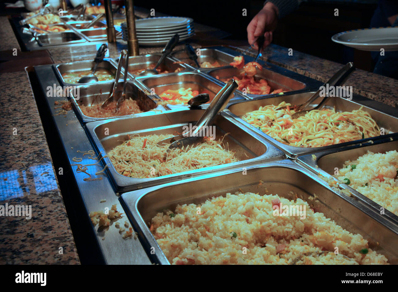 tray filled with rice and spaghetti inside the self service Chinese ...