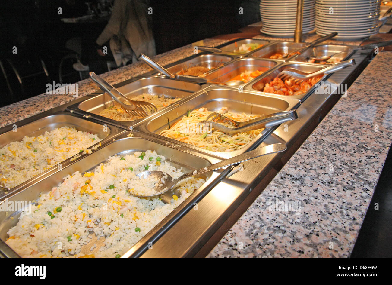 tray with spaghetti or rice in the company canteen Stock Photo - Alamy