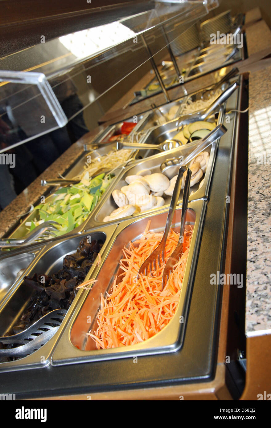serving tray with carrot Greens mushrooms in Asian restaurant Stock ...