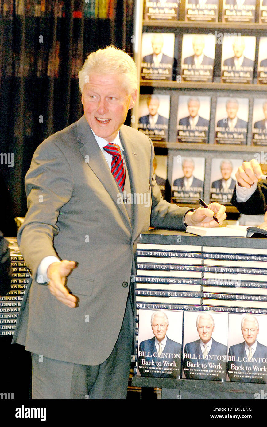 Former U.S. President Bill Clinton signs copies of his new book 'Back ...