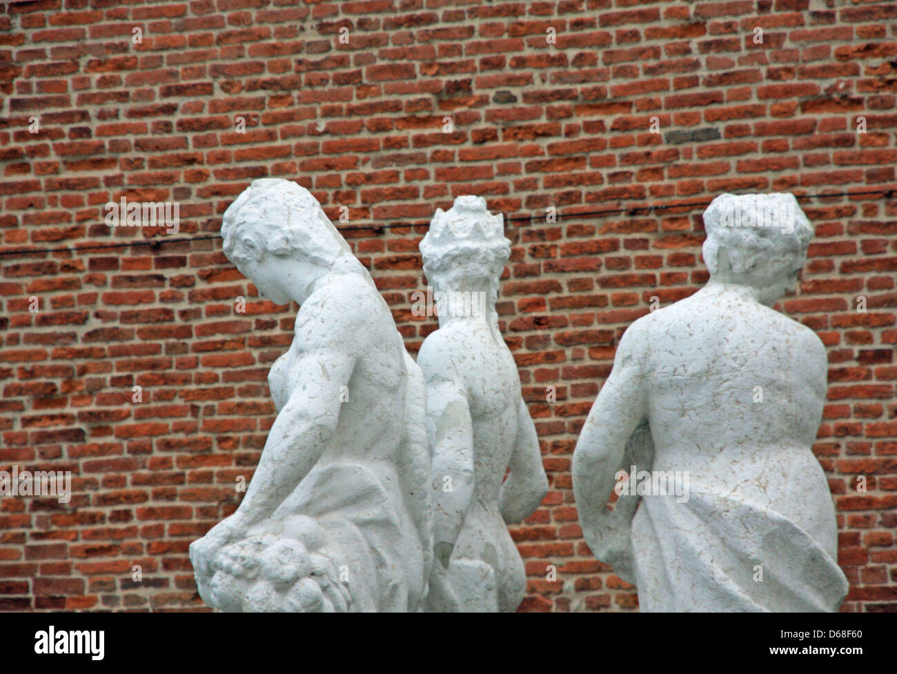 white marble statues and background of rectangular brick red Stock ...