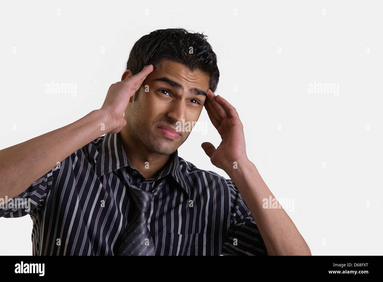 Man getting a headache Stock Photo - Alamy
