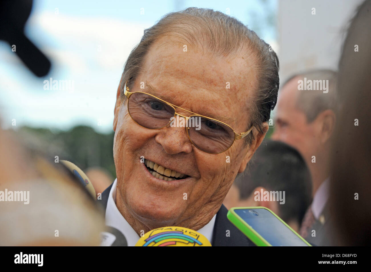 British actor Sir Roger Moore poses for the photographers in front of ...