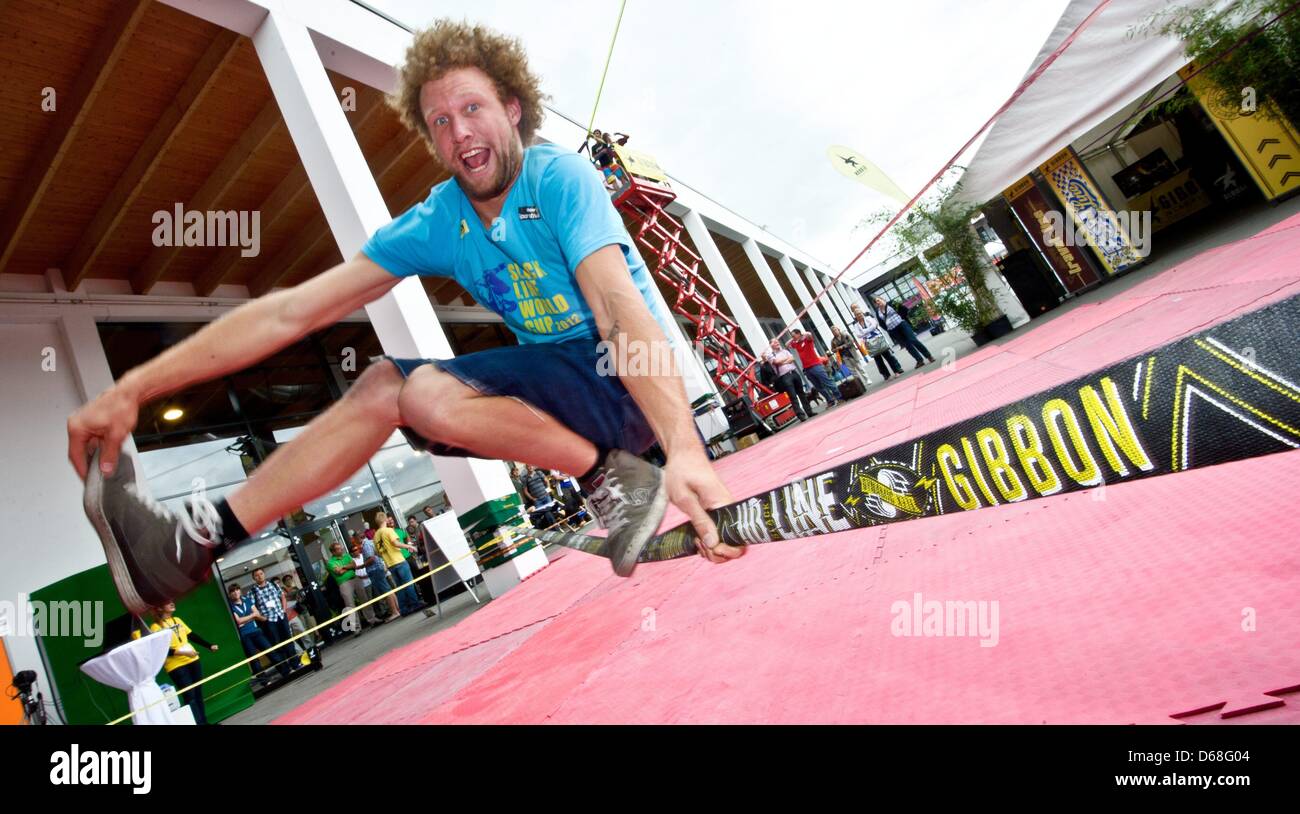 US slackliner Andy Lewis performs various tricks on a slackline of ...
