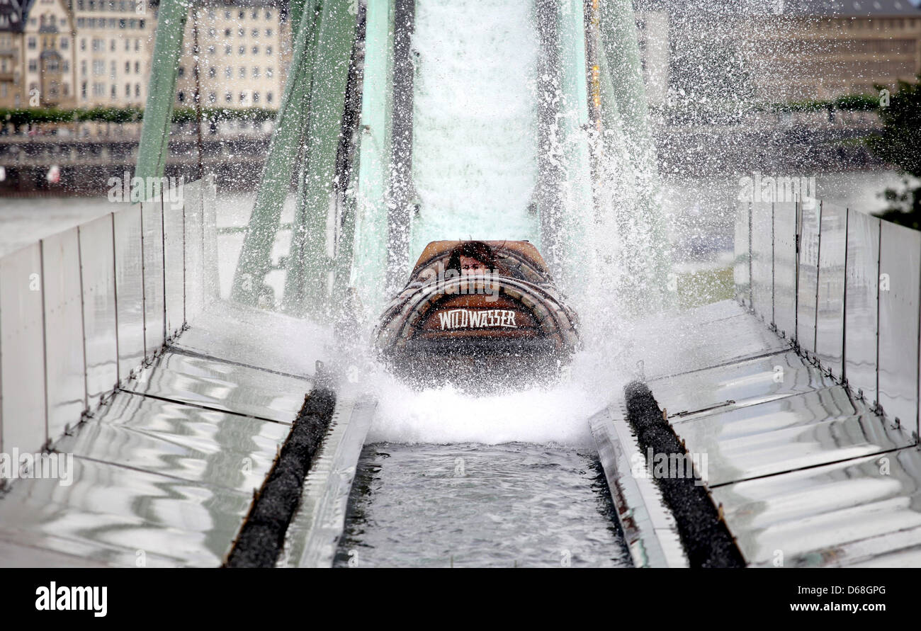 People enjoy a white-water ride at the Duesseldorf Rhine Fair 2012 ...