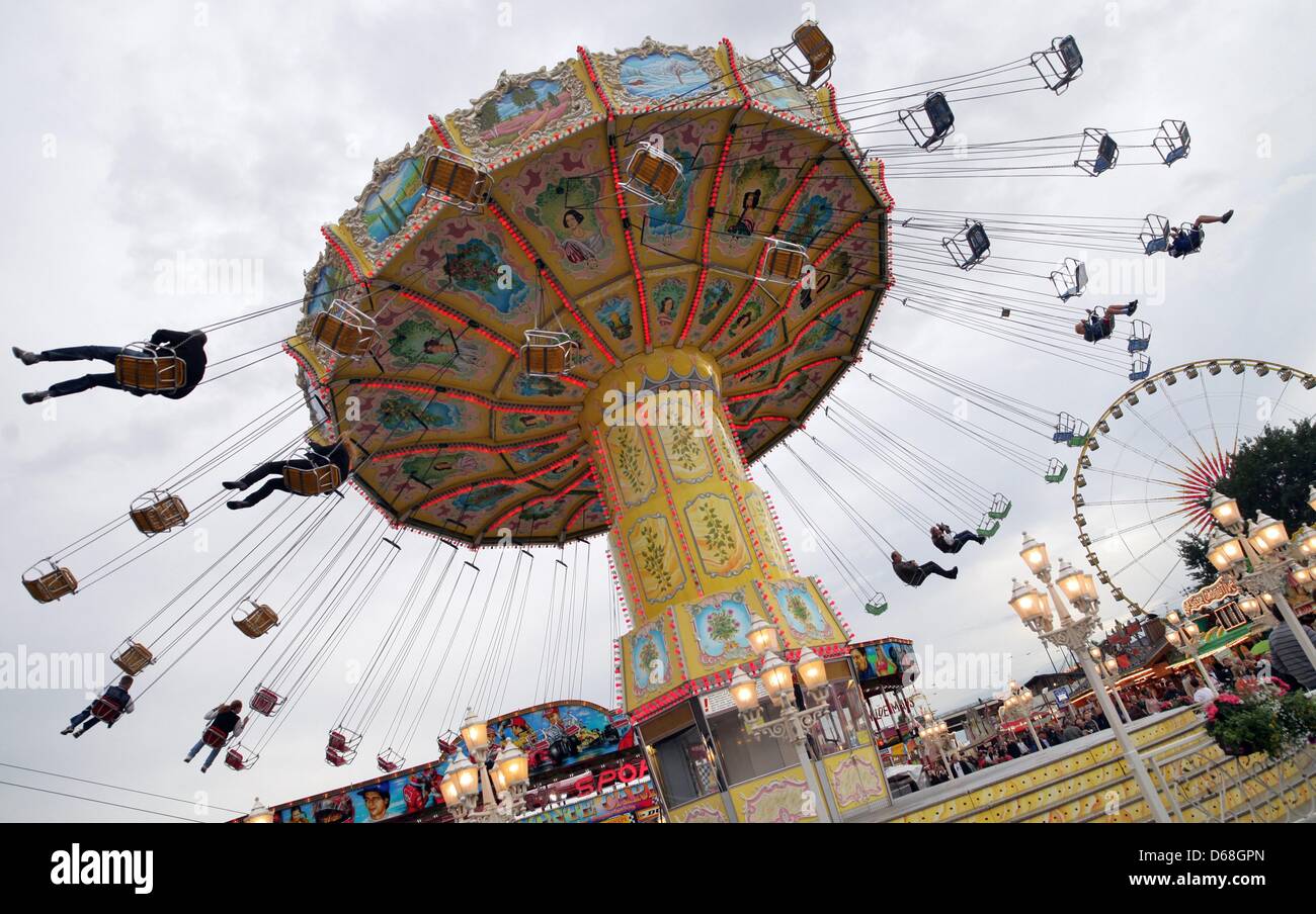 A flying swing is featured at the Duesseldorf Rhine Fair 2012 ...