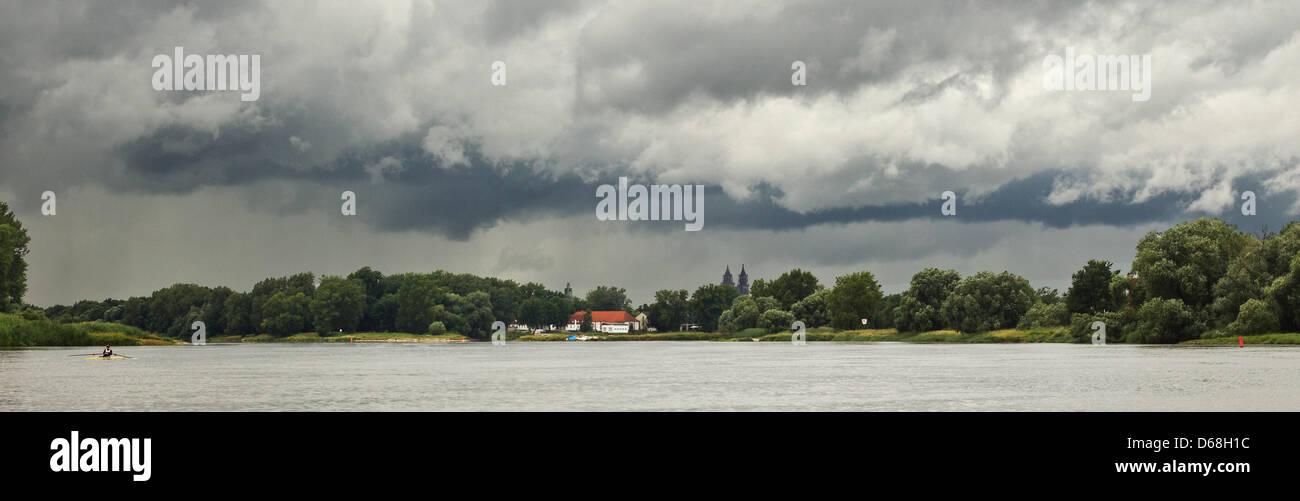 Dark clouds appear above the city of Magdeburg at the Elbe river, Germany, 13 July 2012. Rainy ...