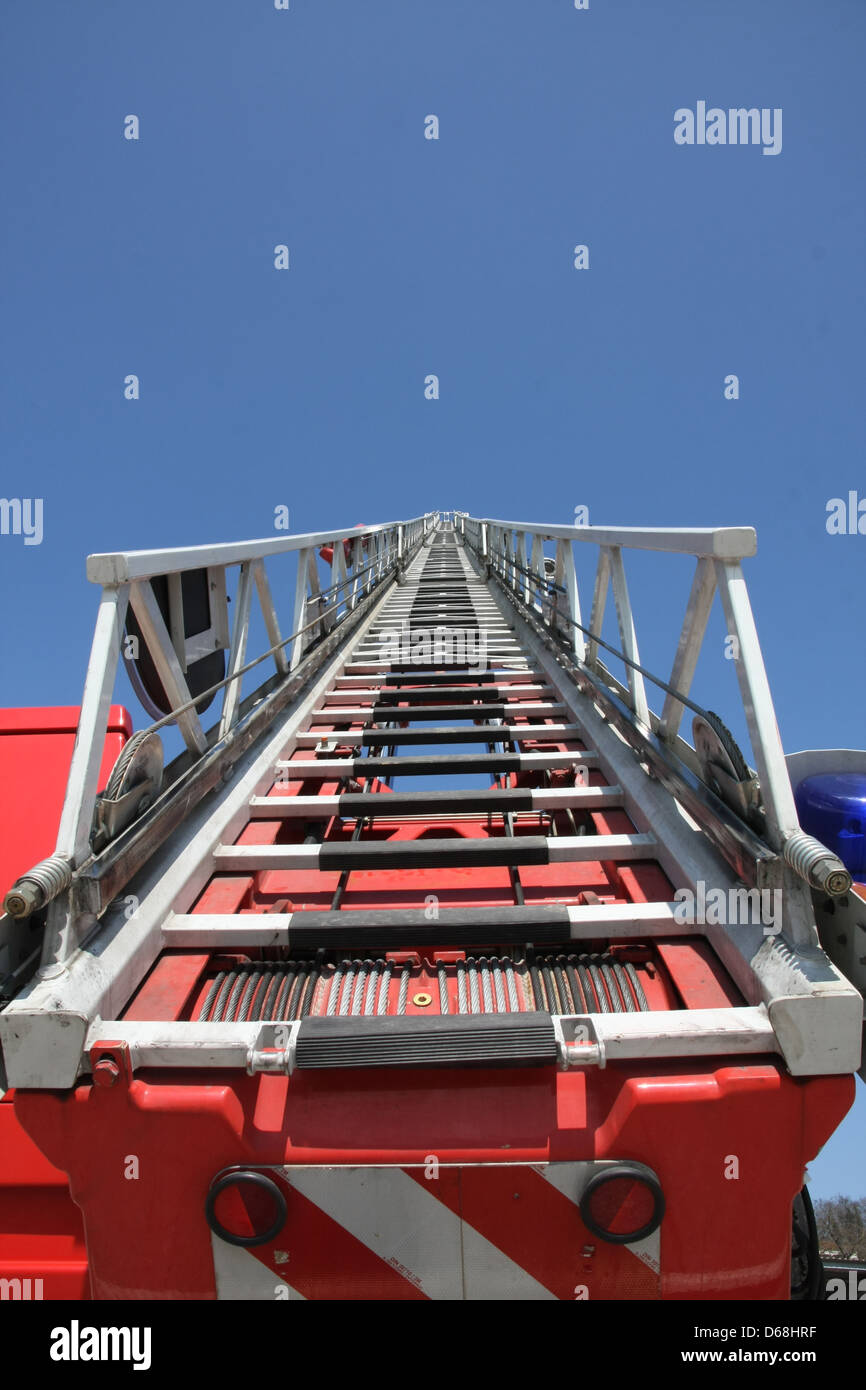 scale up a ladder of firefighters during an emergency to save the ...