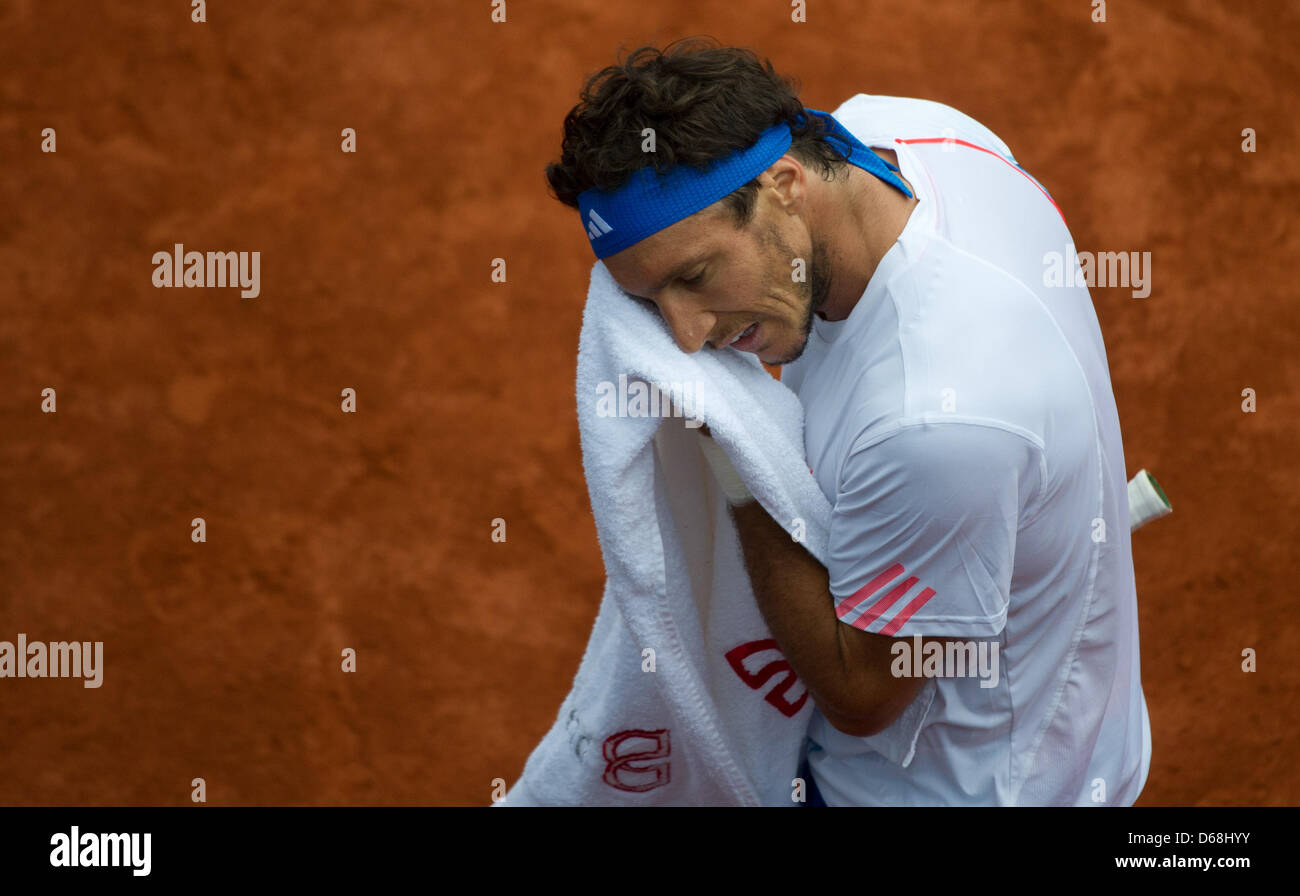Argentina's Juan Monaco wipes his face during during the final match of ...