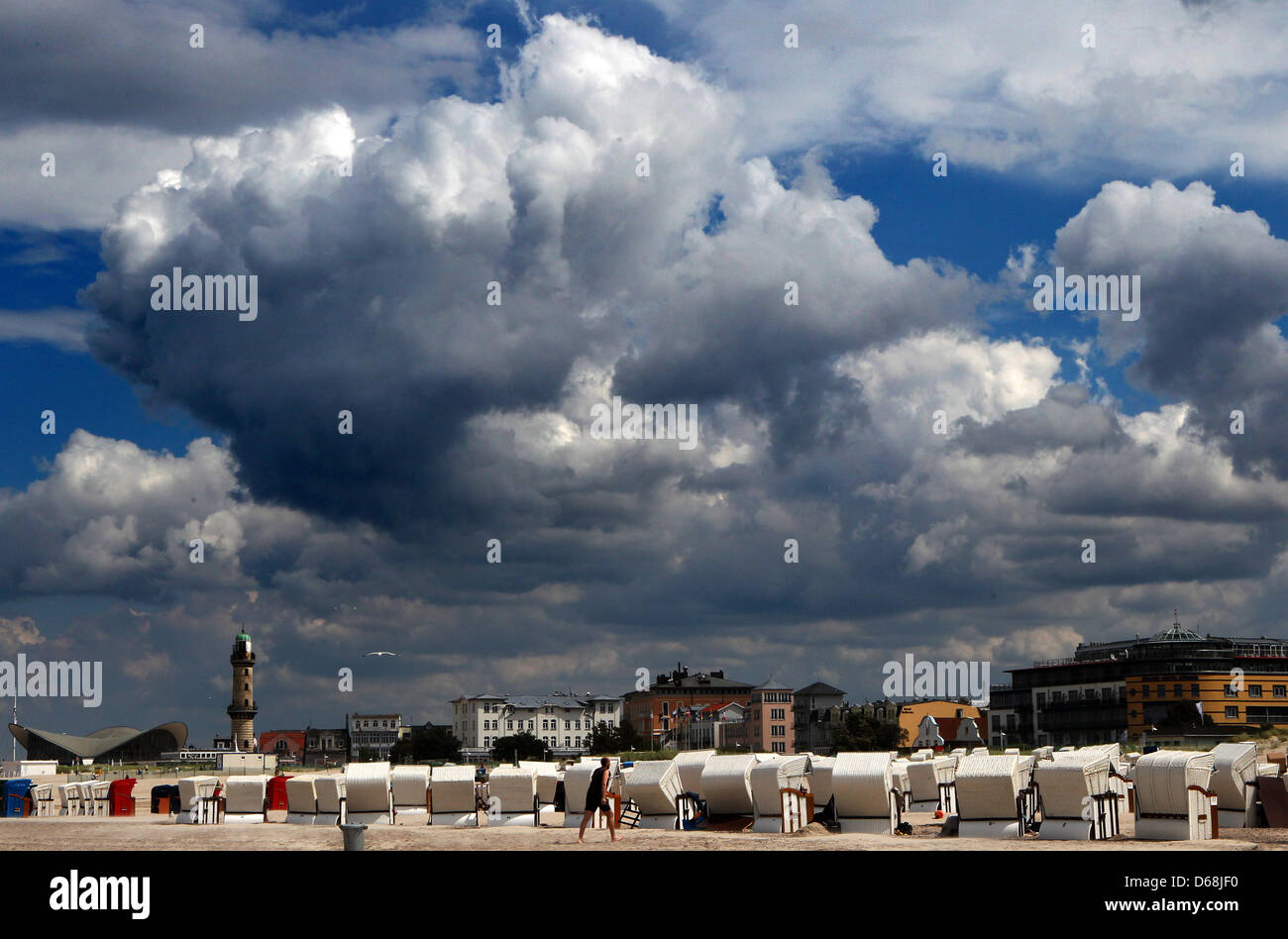 Rain clouds darken the sky over the Baltic sea bath in Warnemuende ...