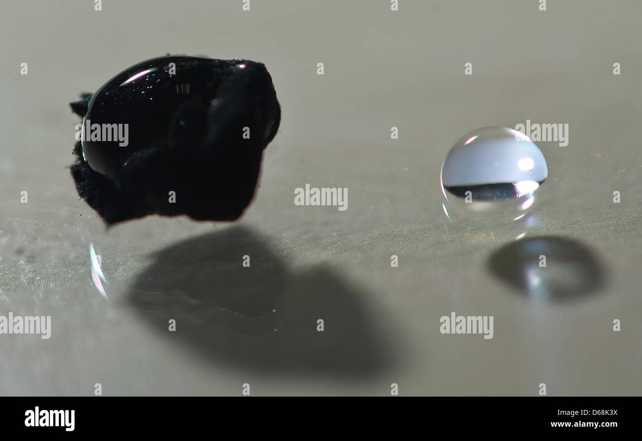 A water drop lies on a piece of the new material Aerographite next to ...