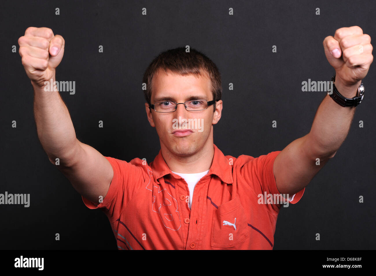 Man raising his arms in success Stock Photo - Alamy