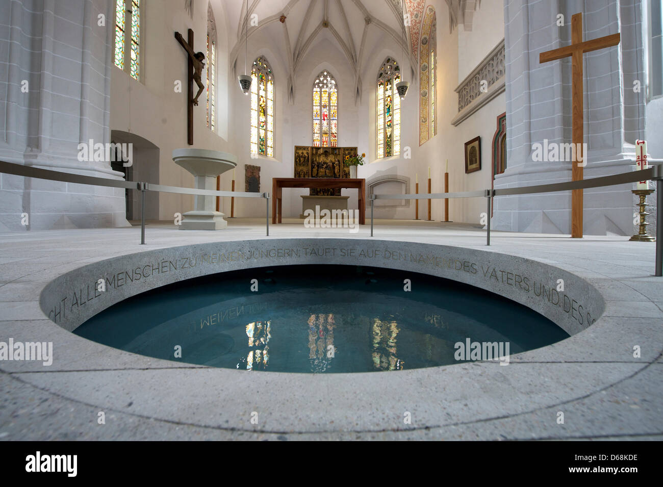 The baptismal font is pictured in the Church of St. Peter and Paul in ...