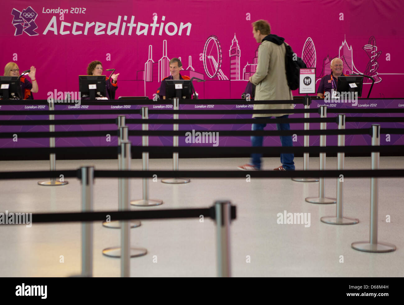 Empty lanes are seen at the Olympic Accreditation Desk in London, Great ...